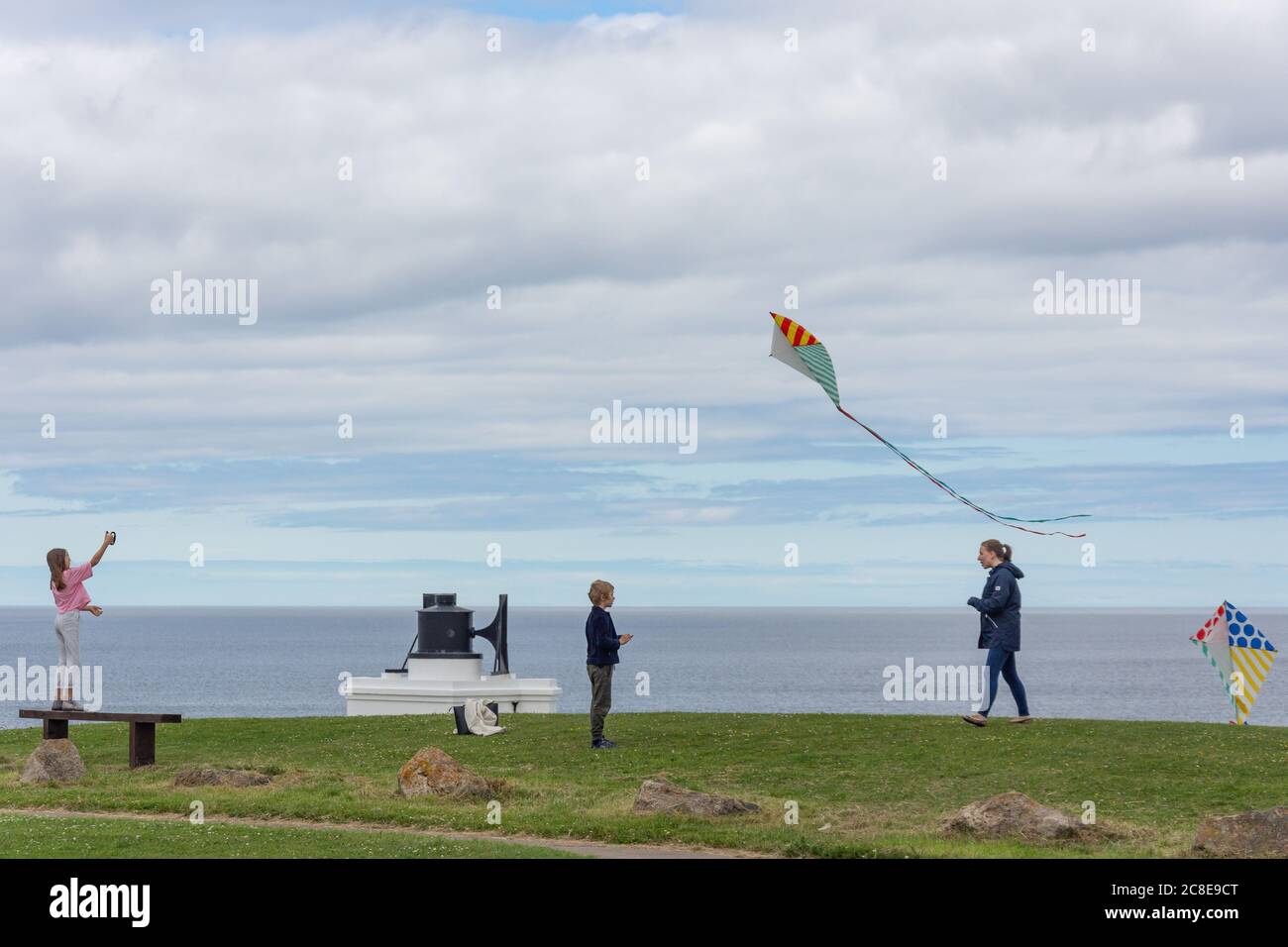 Children flying kites by souter lighthouse marsden south shields hi-res ...