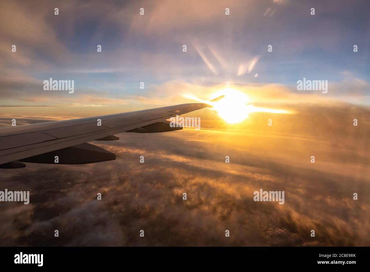 View on passenger aircraft right wing during holiday trip. Sunset ...