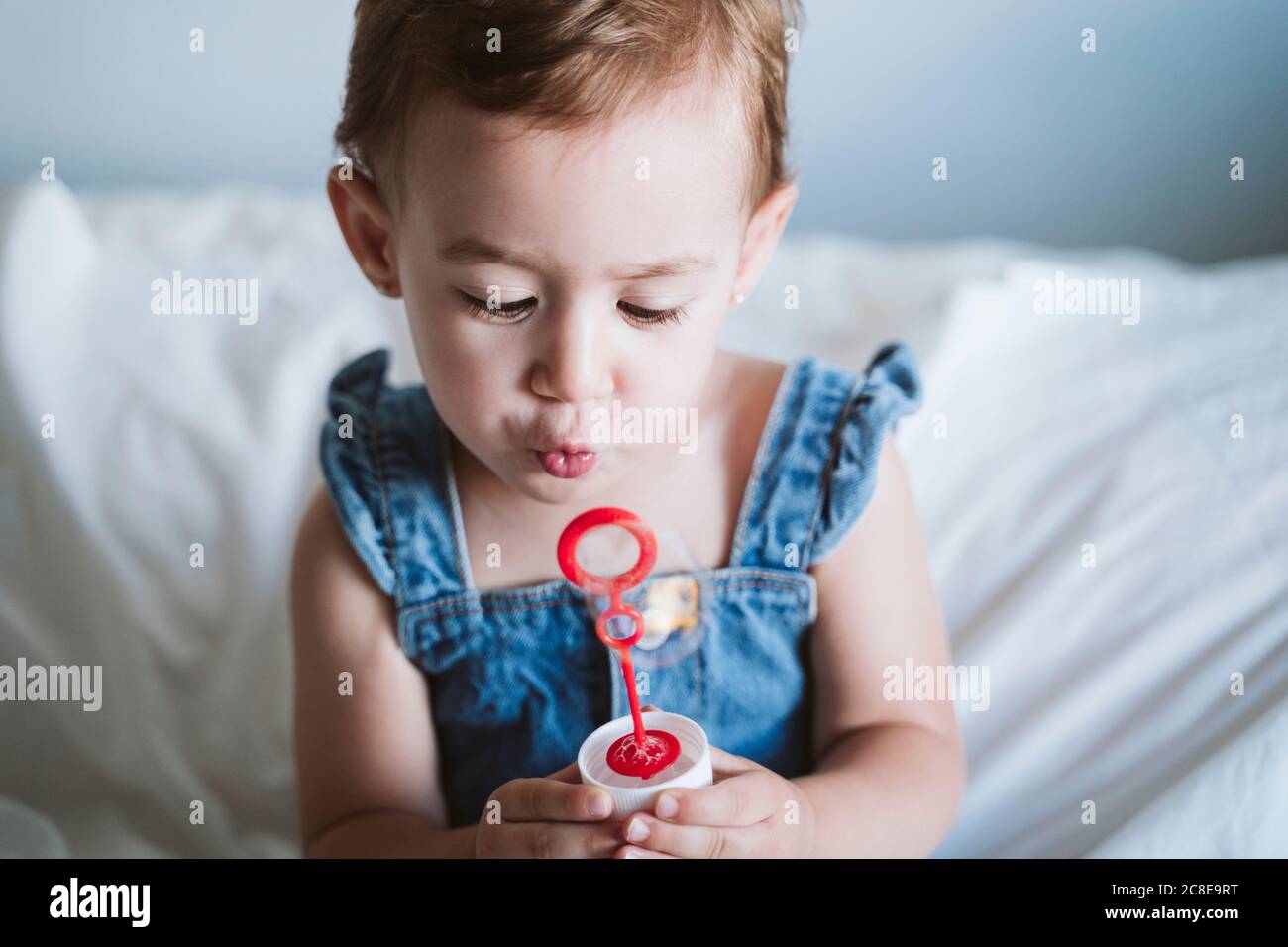 Baby girl playing bubbles hi-res stock photography and images - Alamy