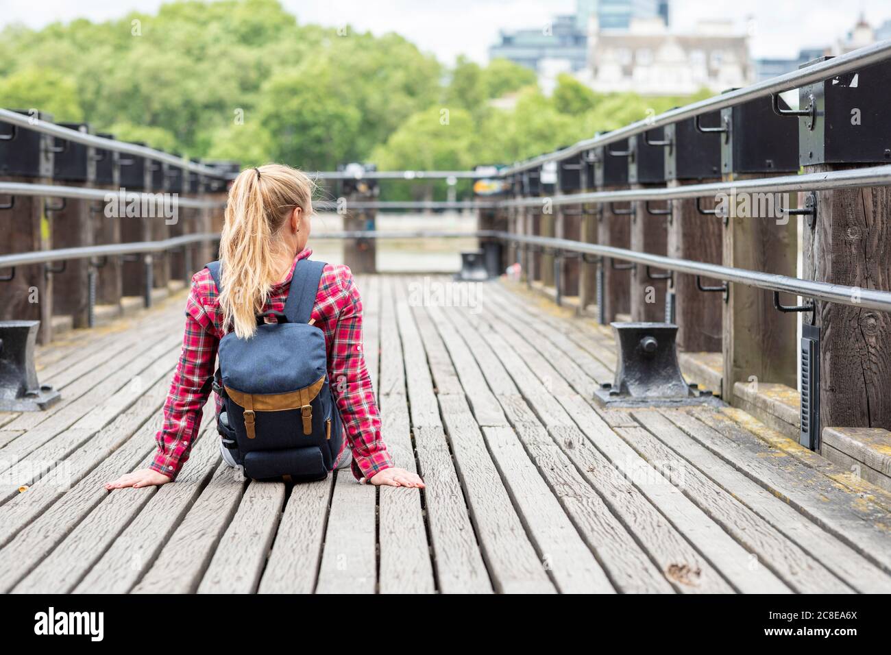 Rear view woman bridge city hi-res stock photography and images - Alamy
