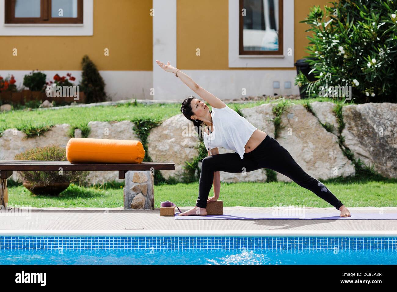 Mature woman stretching in the pool hi-res stock photography and images ...