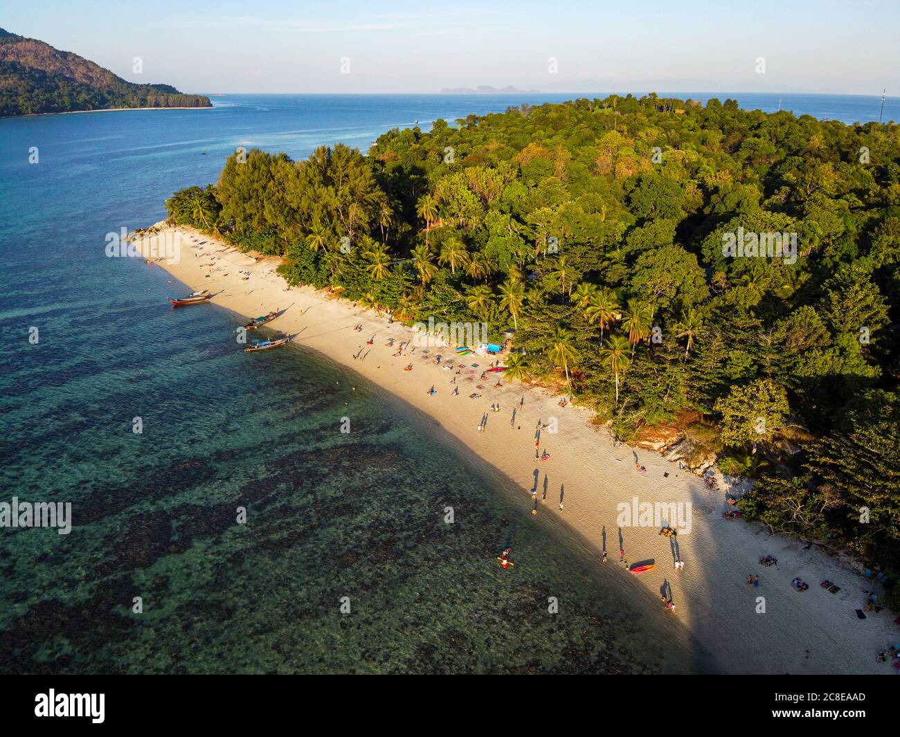 Thailand, Satun Province, Ko Lipe, Aerial view of people relaxing along ...