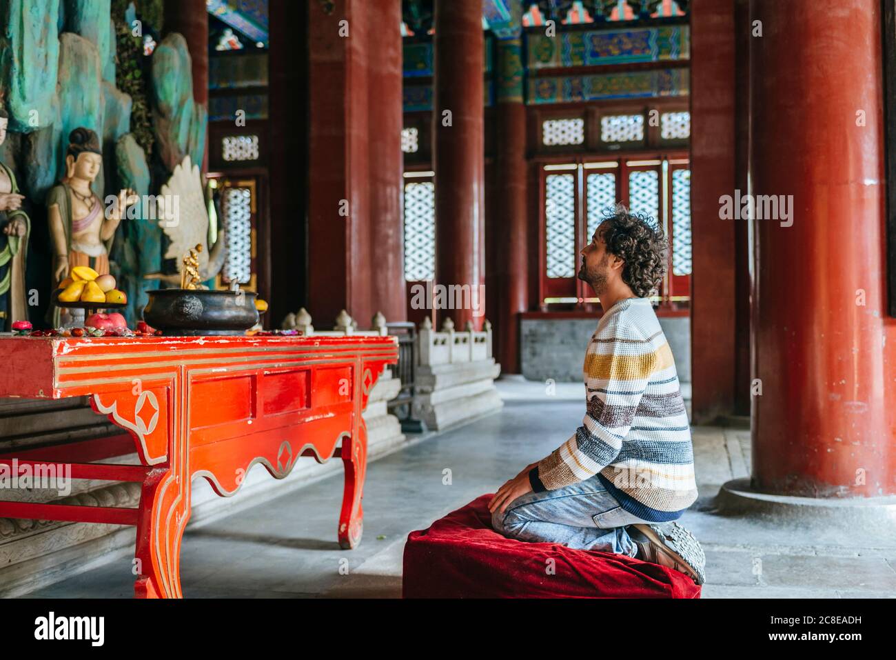 Asia man praying at temple hi-res stock photography and images - Alamy