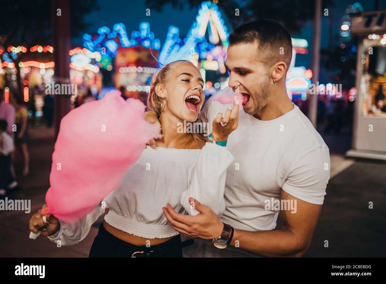 Man feeding woman candy hi-res stock photography and images - Alamy