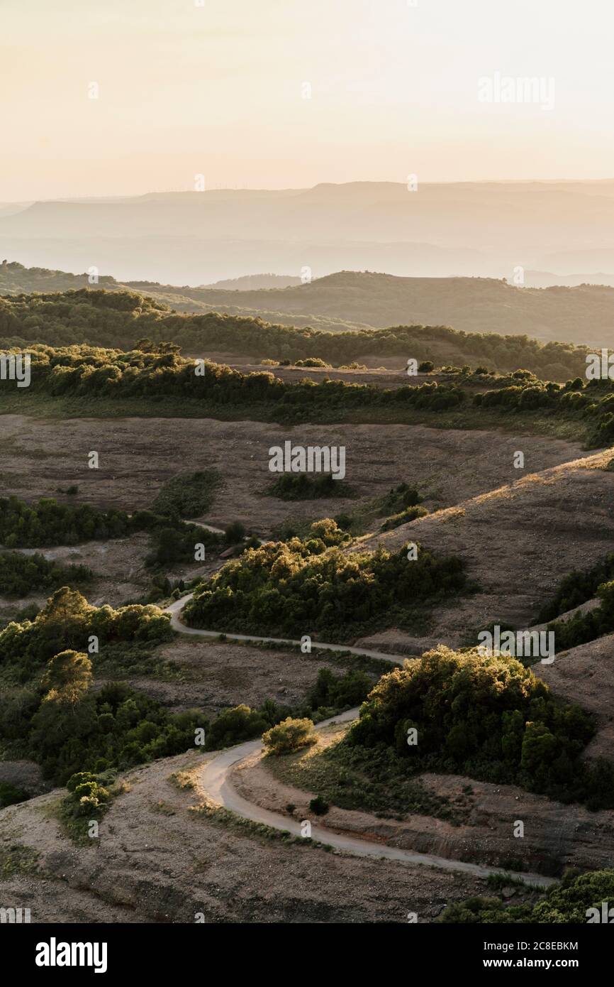 Winding road at sunset hi-res stock photography and images - Alamy