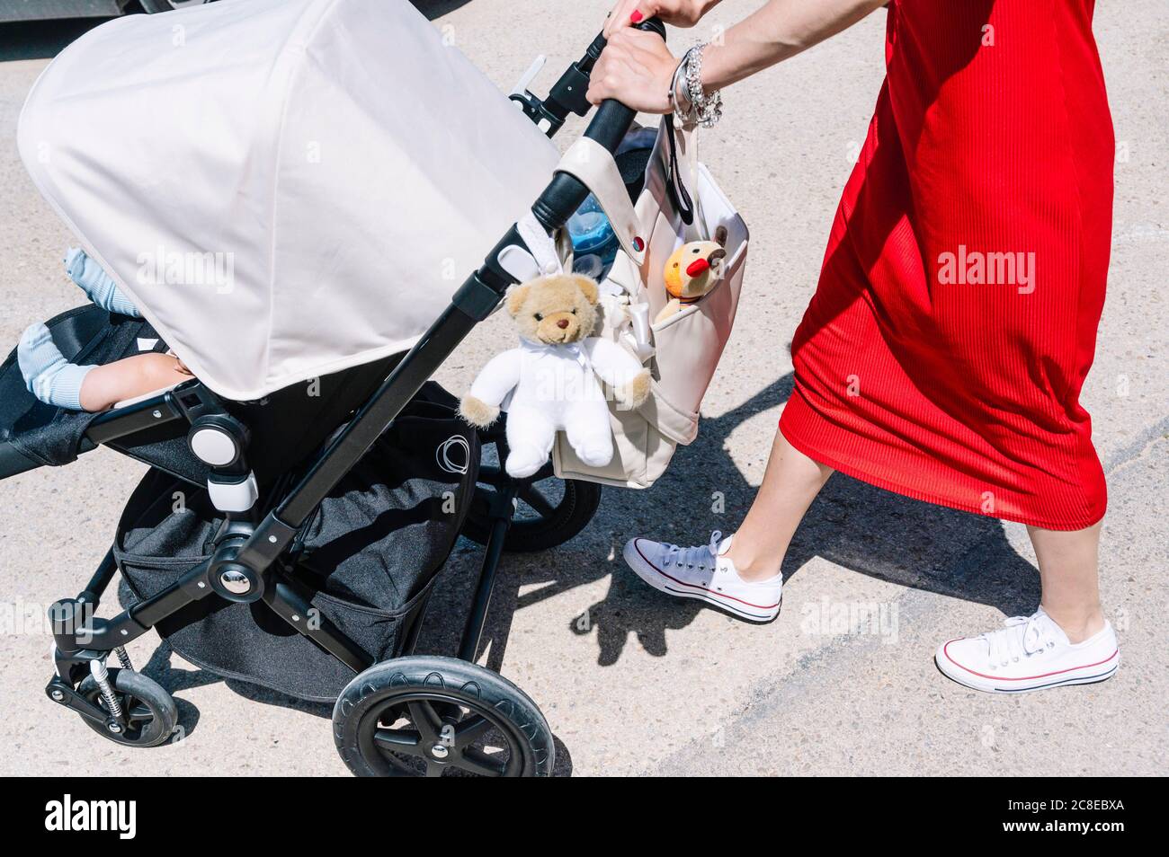 Pushing toy baby carriage hi-res stock photography and images - Alamy