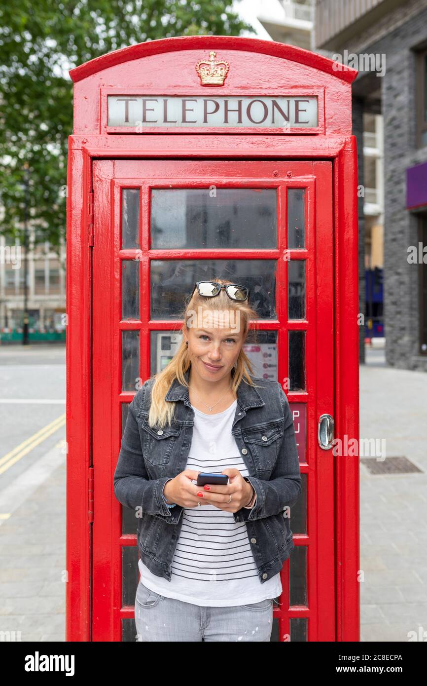 Woman phone booth hi-res stock photography and images - Alamy