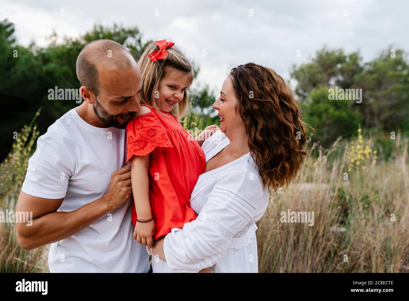 Happy cheerful positive family hi-res stock photography and images - Alamy