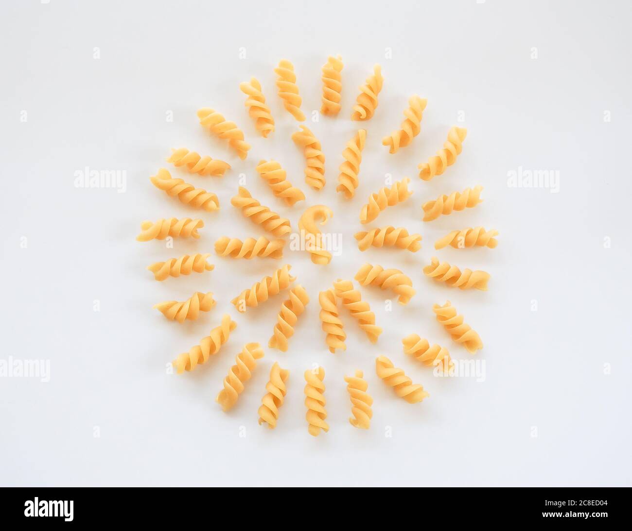 Twisted raw pasta food knolling circle shape white background Stock ...