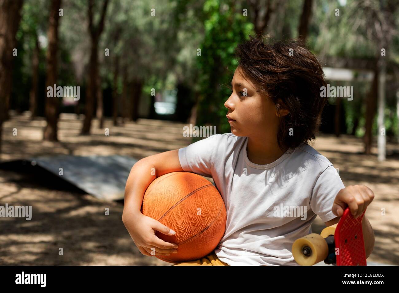 Kid Playing Basketball Alone