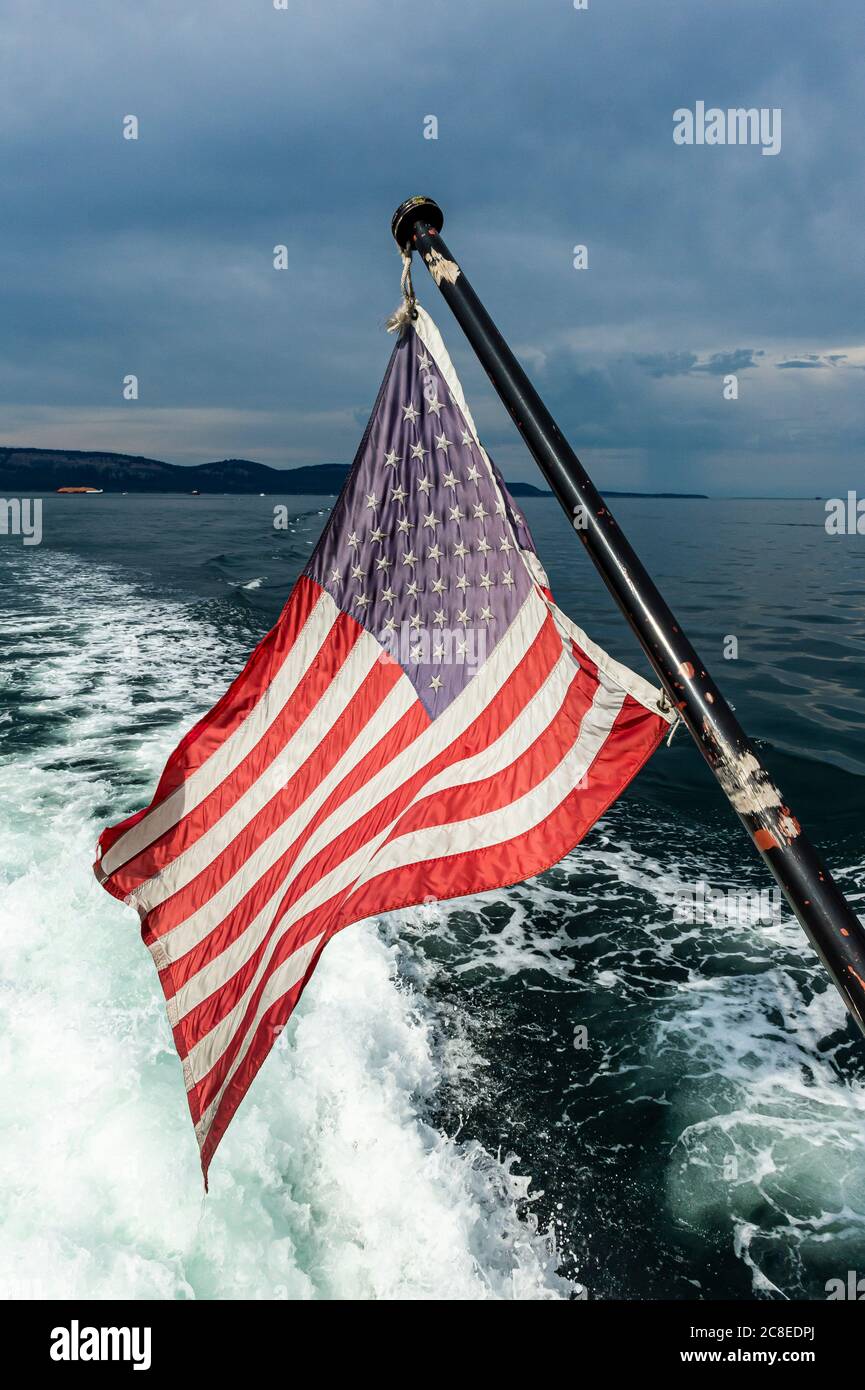 American flag on back of moving motorboat hi-res stock photography and ...