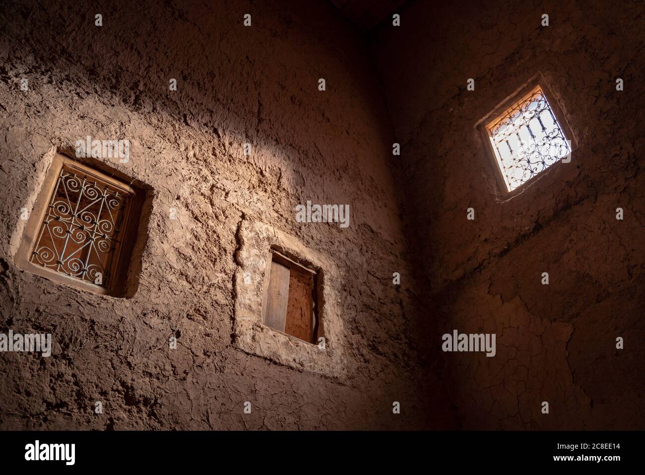 Low angle view of windows in old clay house Stock Photo - Alamy