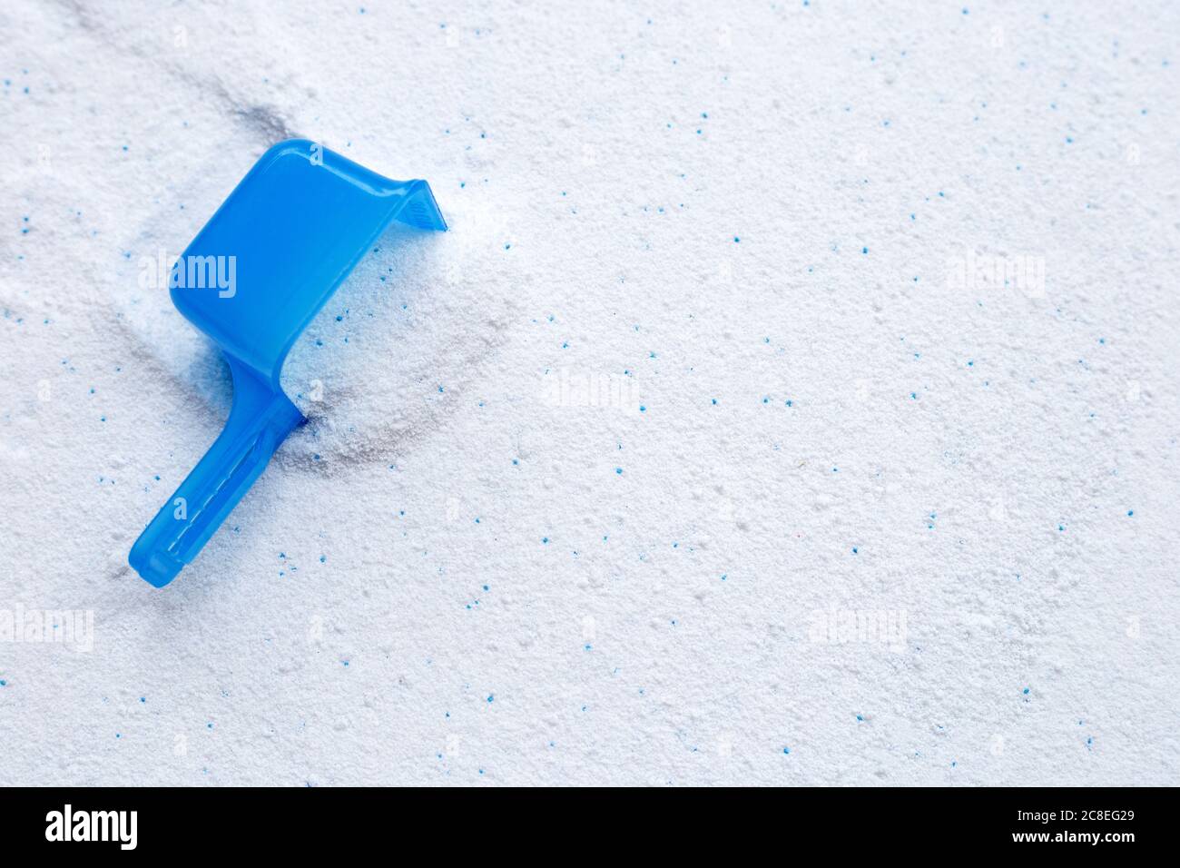 Detergent powder with measuring spoon for clothes washing. Laundry ...