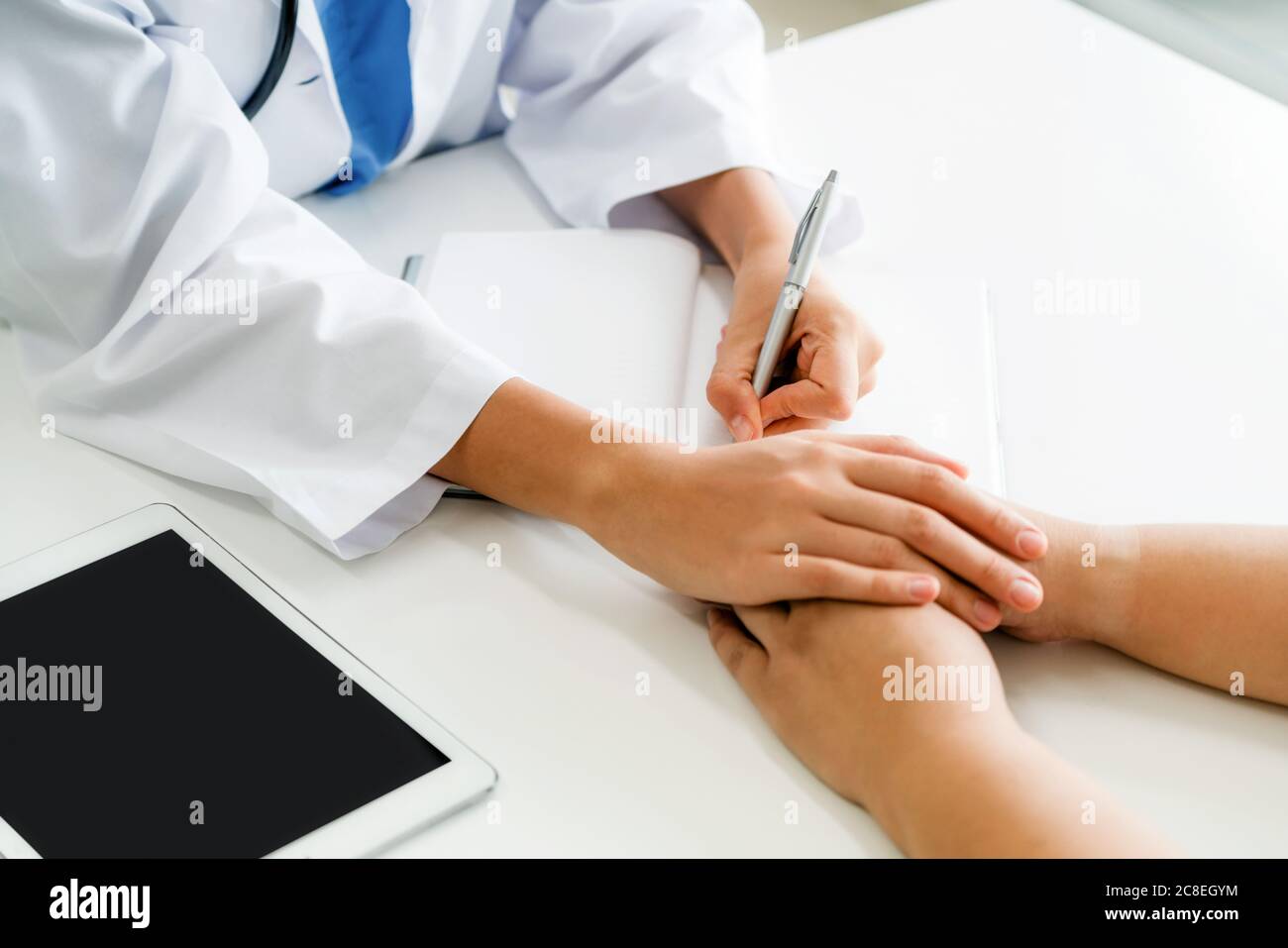 Kind doctor and patient hi-res stock photography and images - Alamy