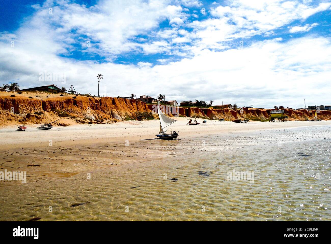 Beautiful beach in Aracati with a jangada (boat). Canoa quebrada beach ...
