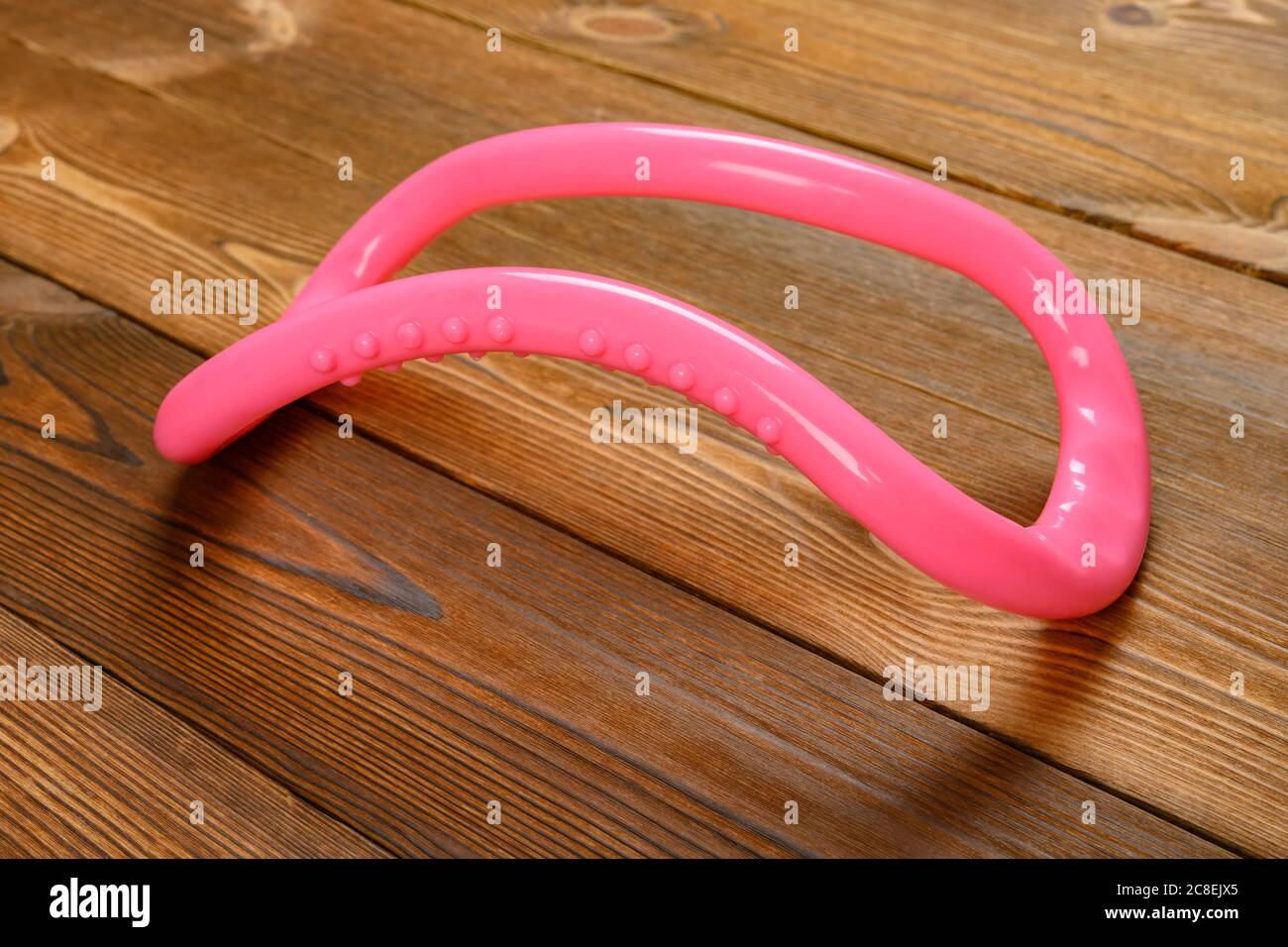 side view yoga hook on a wood background Stock Photo - Alamy