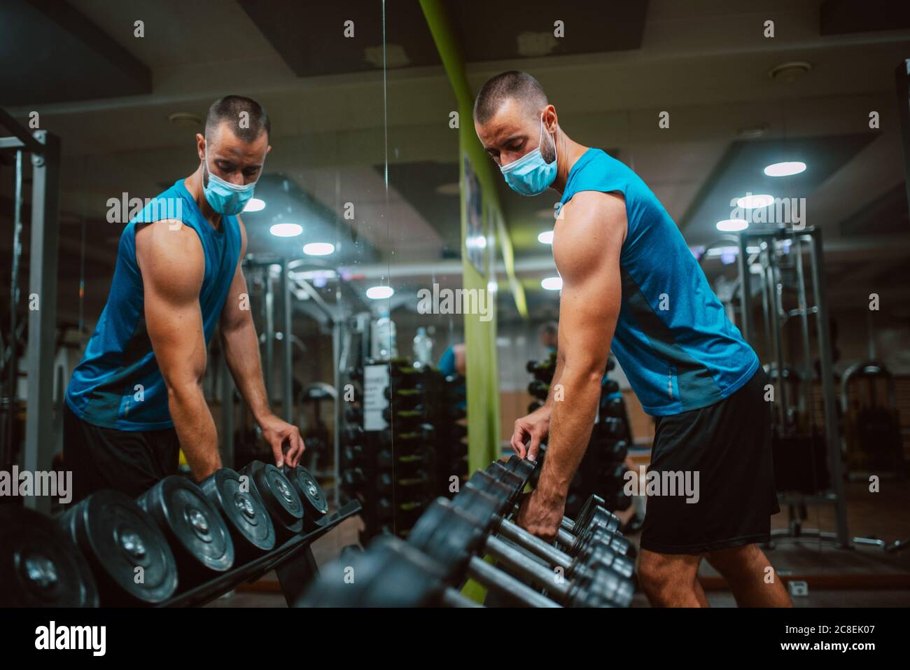 A young muscular caucasian athlete man with a mask on his face ...
