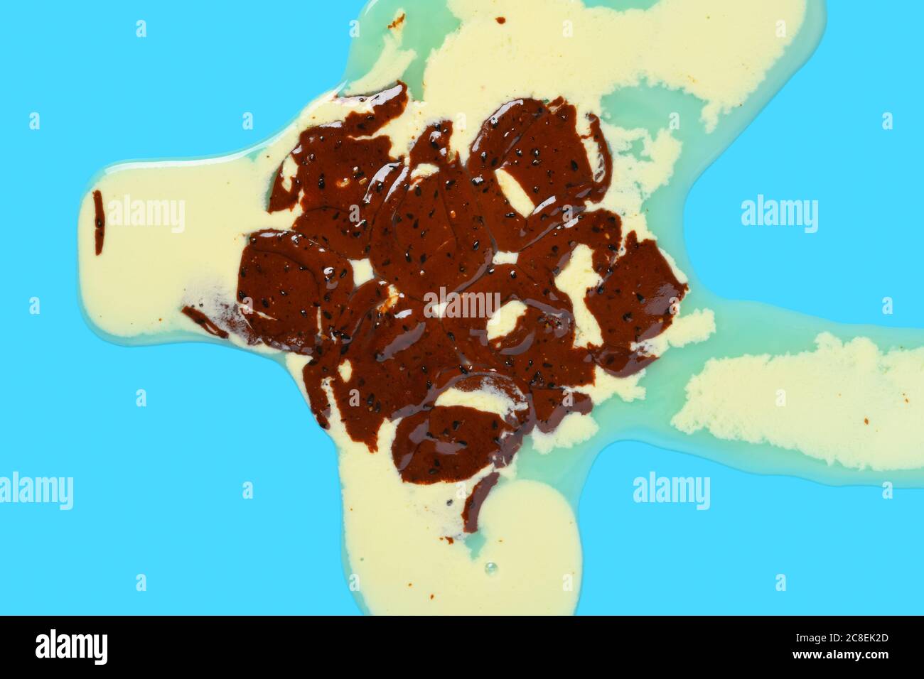 top view melted chocolate blocks with vanilla flavor ice cream on blue ...