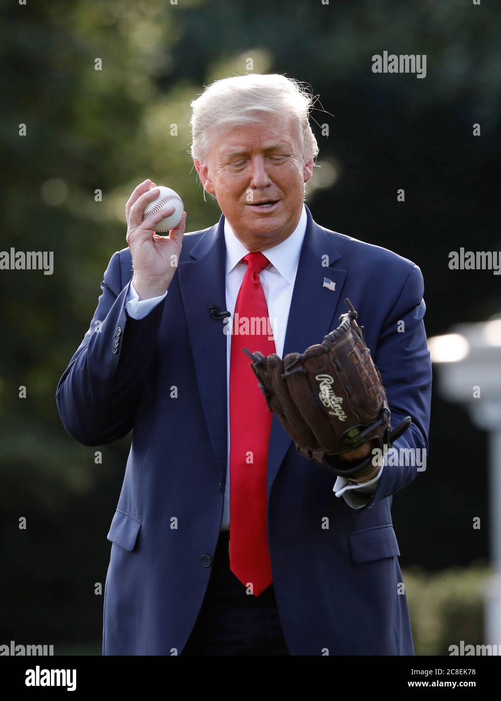 United States President Donald J. Trump catches a ball to mark the ...