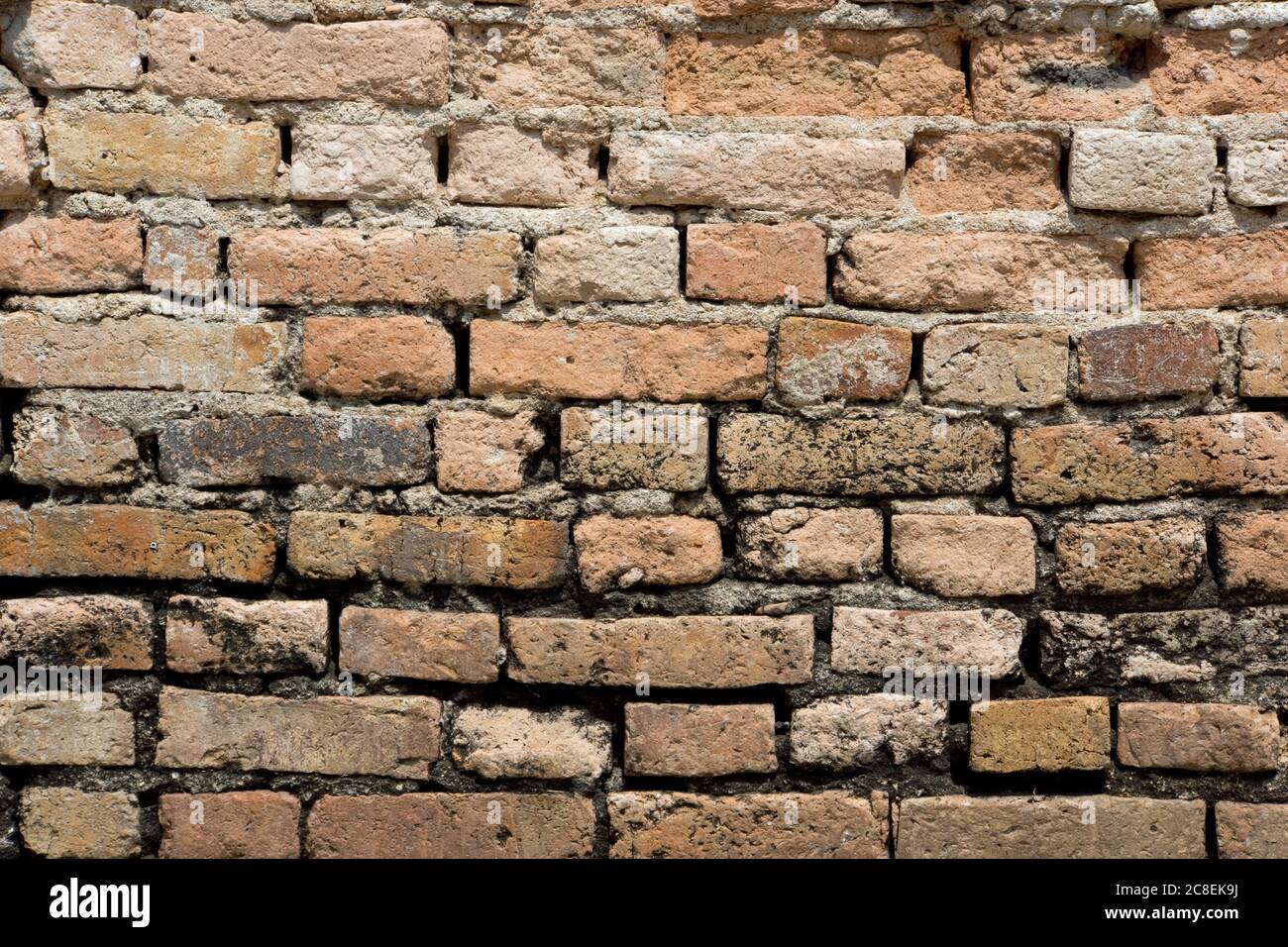 Weathered brick wall background showing vintage bricks, mortar and ...