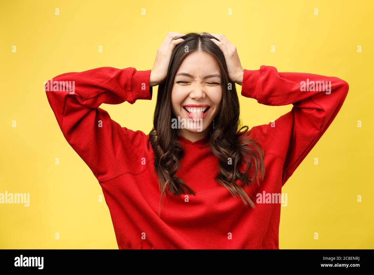 Portrait Happy Asian girl is surprised she is excited.Yellow background ...