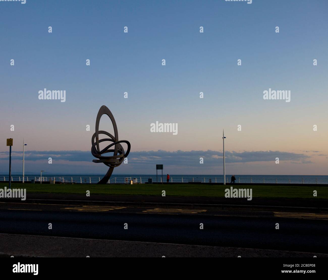 Sculpture on a beach promenade. Public art, curves, modern art ...
