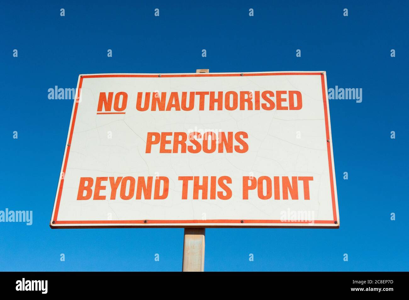 Isolated warning sign restricted access on blue sky background and copy ...