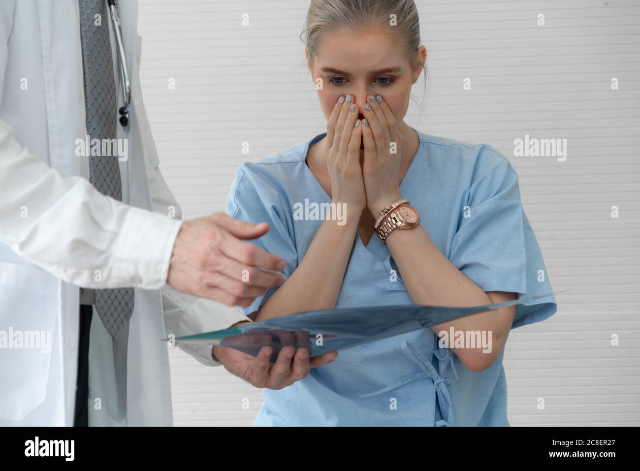 Sad patient with doctor hi-res stock photography and images - Alamy