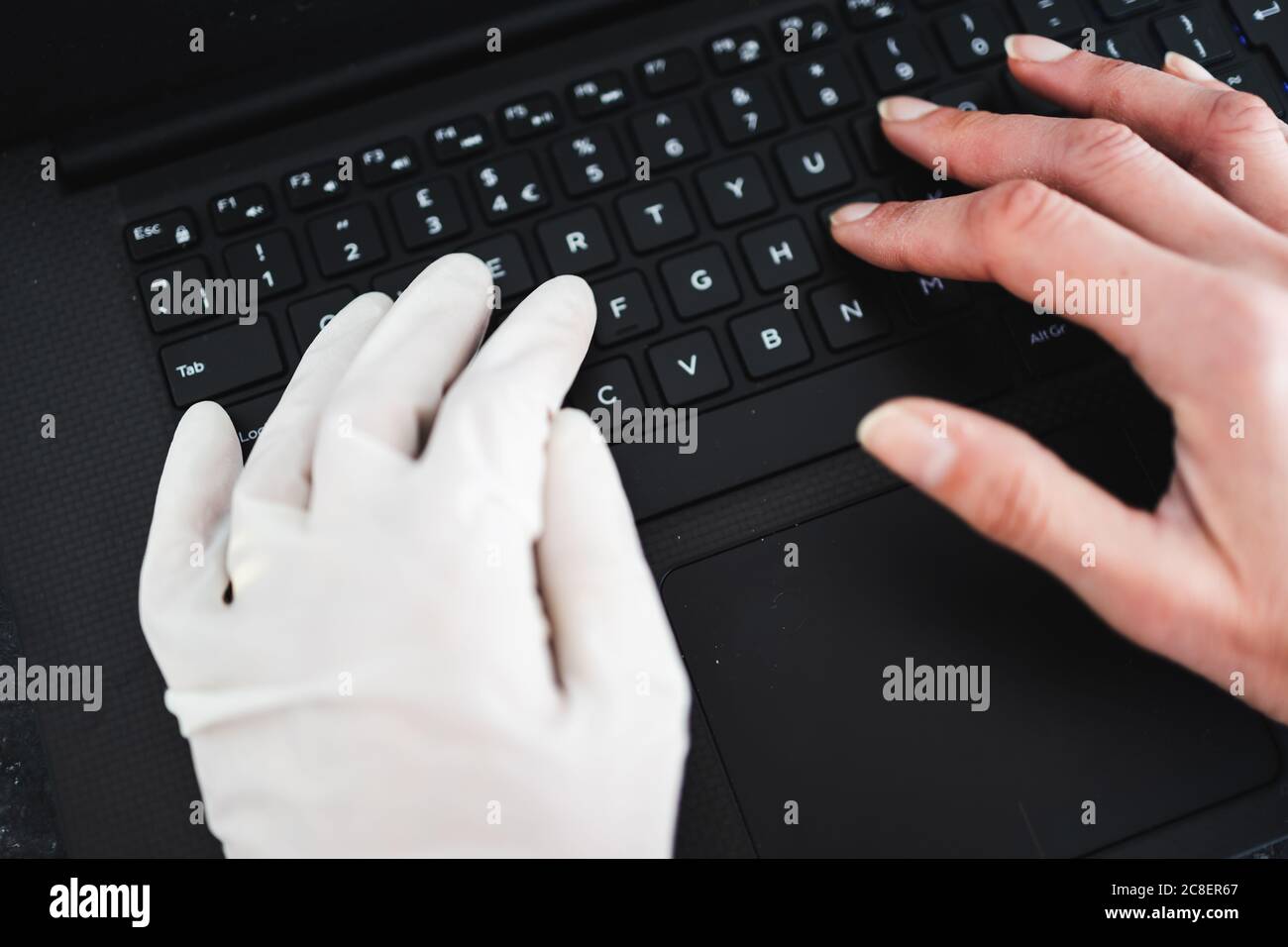 staying safe after the covid-19 virus pandemic outbreak, hand typing on ...