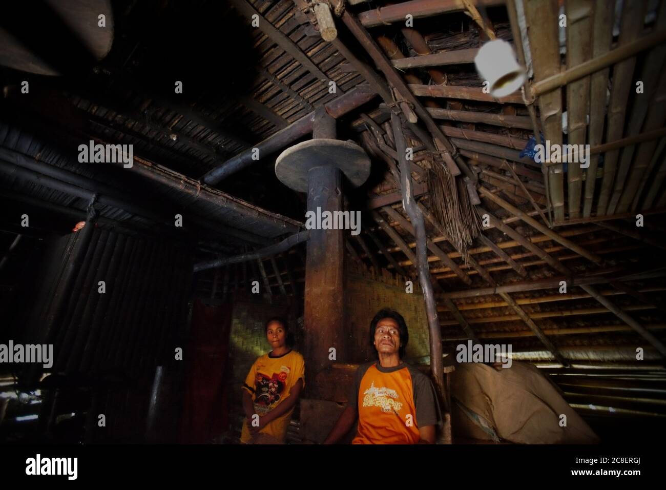 Portrait of a Sumbanese family inside their traditional house in Tebara ...