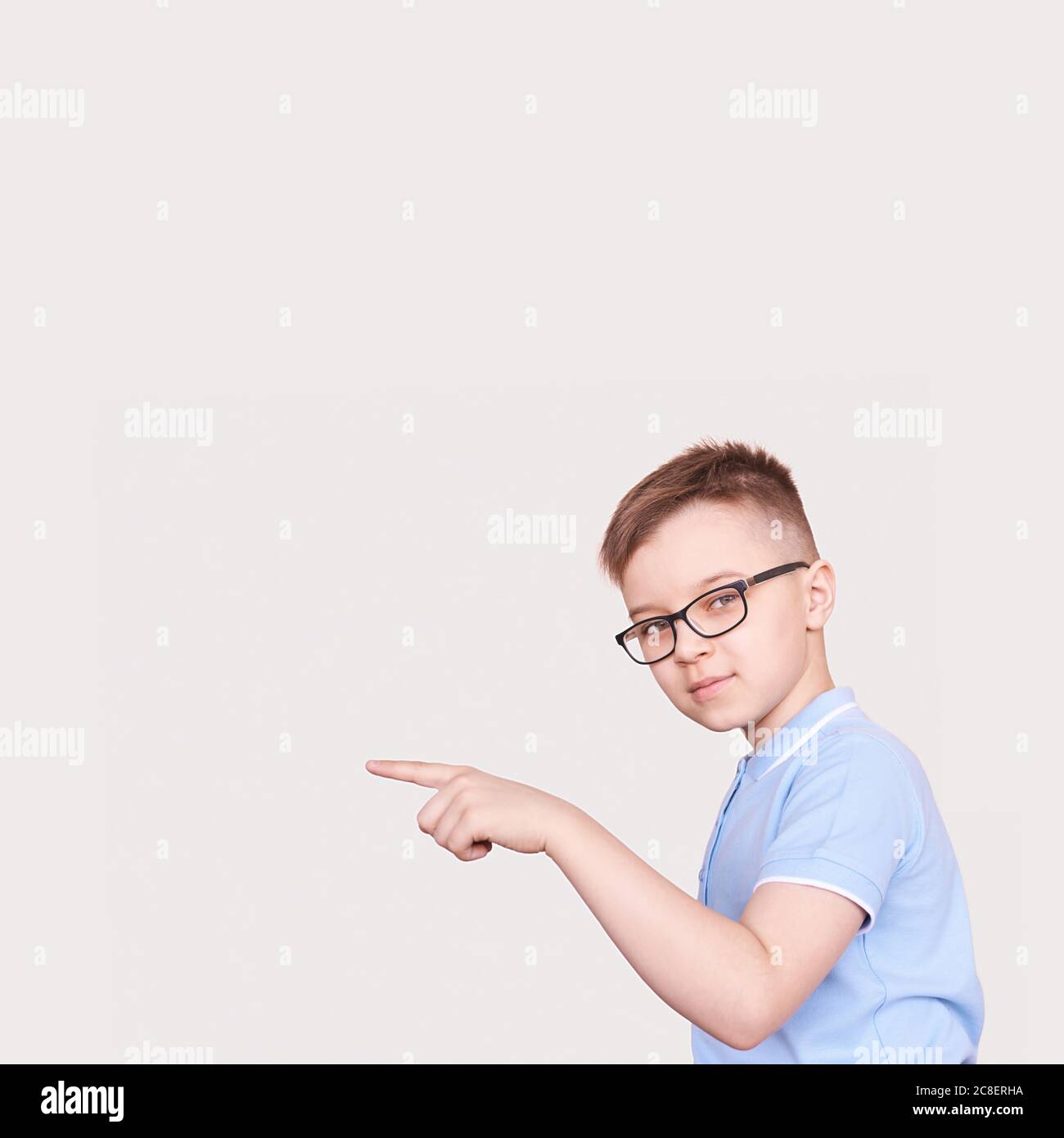 Pretty young student pointing. Elementary school children Stock Photo ...