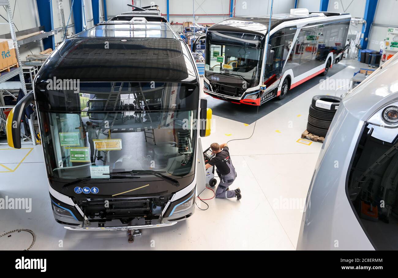 16 July 2020, Saxony, Plauen: An employee of the MAN Bus Modification ...