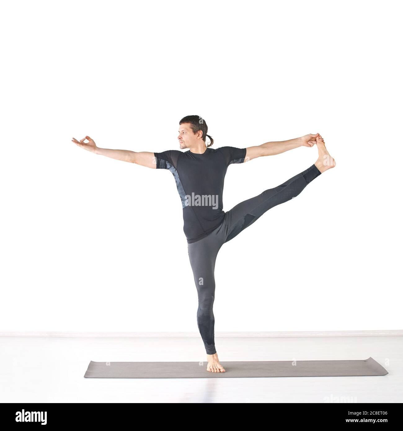 Man yoga class. Black wear. Calm relax pose Stock Photo - Alamy