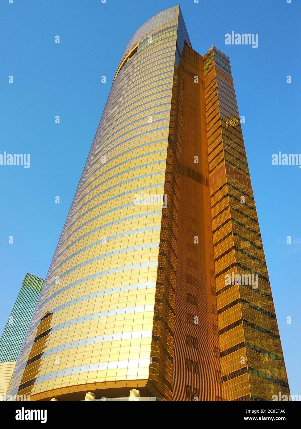 Golden building under sunny day in Shanghai Stock Photo - Alamy