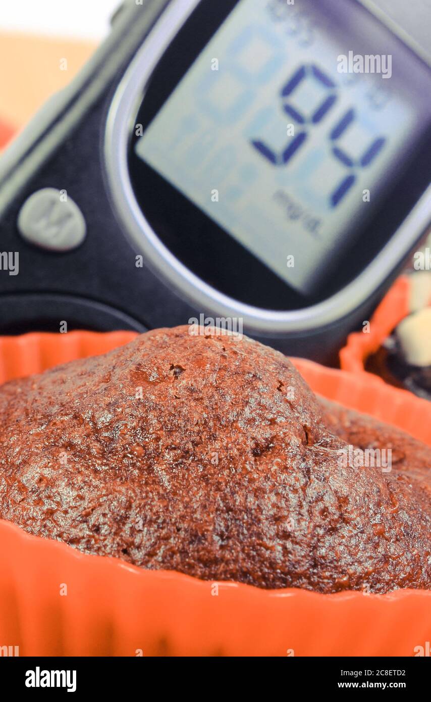 Glucometer for checking sugar level and fresh baked homemade chocolate ...