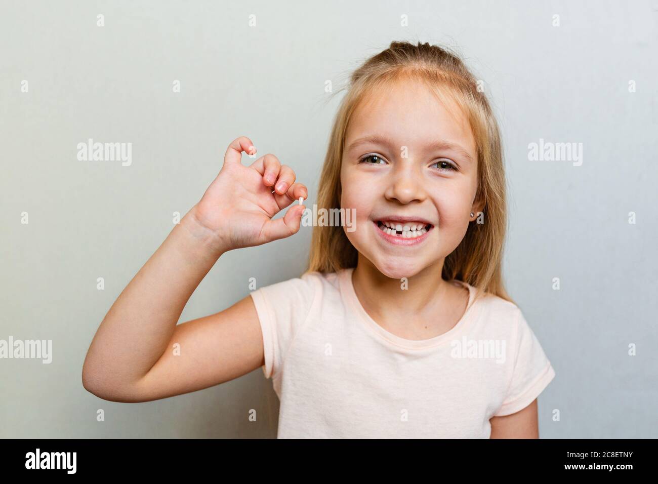 Kid showing the first milk tooth. Change teeth concept. Cute little ...