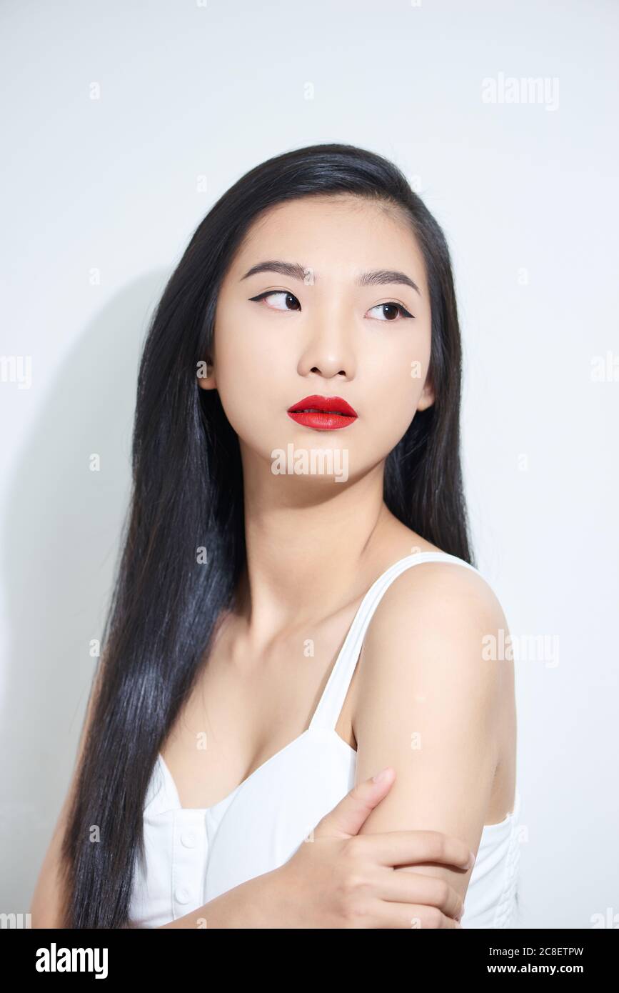 Woman over isolated white background looking forward Stock Photo - Alamy