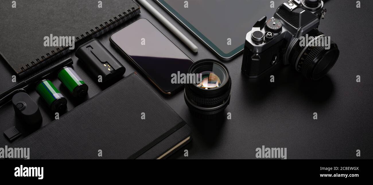 Cropped shot of digital devices with camera, smartphone, tablet ...