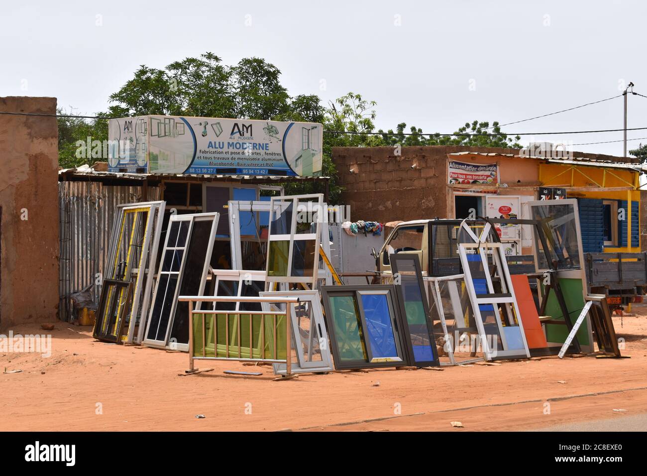 A shop selling windows and doors, on display outside, in Niamey, Niger ...