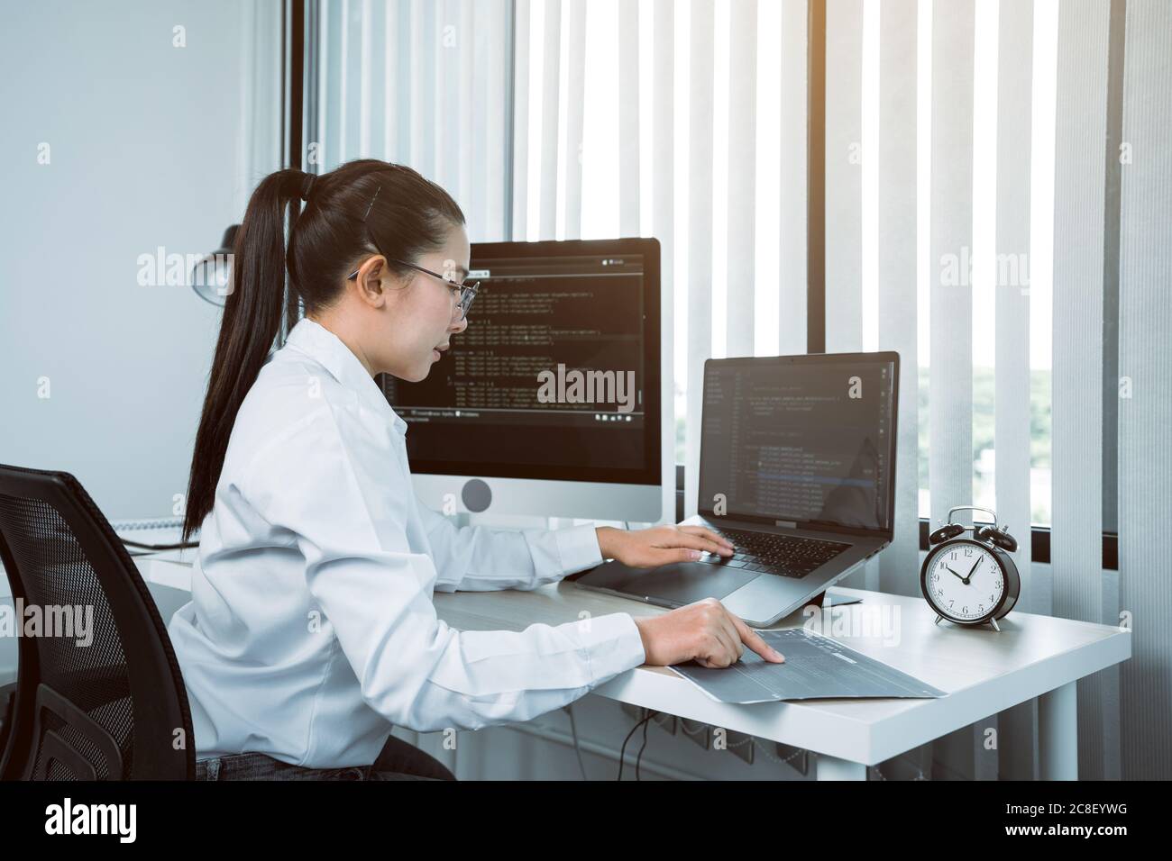 Software Developers Are Analyzing About The Code Written Into The Program On The Computer In