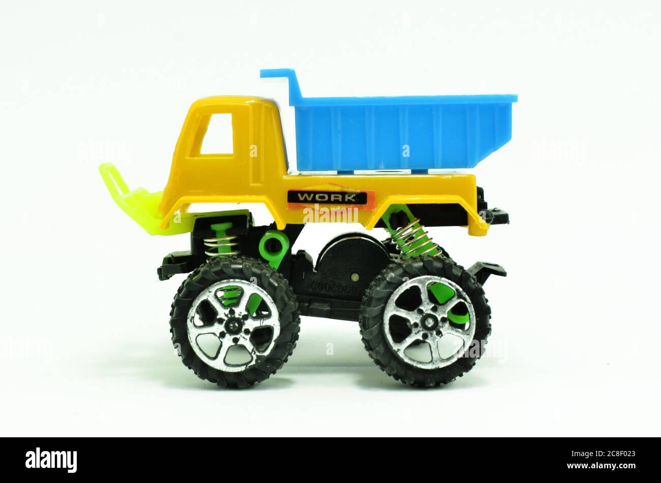 Plastic dump truck toy isolated on white background Stock Photo - Alamy