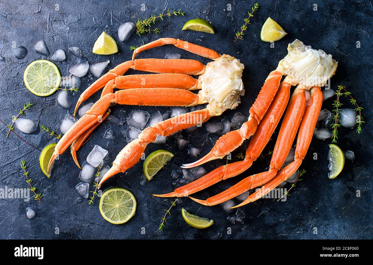 Fresh crab claws, lime, spices, spices, ice, shrimp, vegetables on a ...