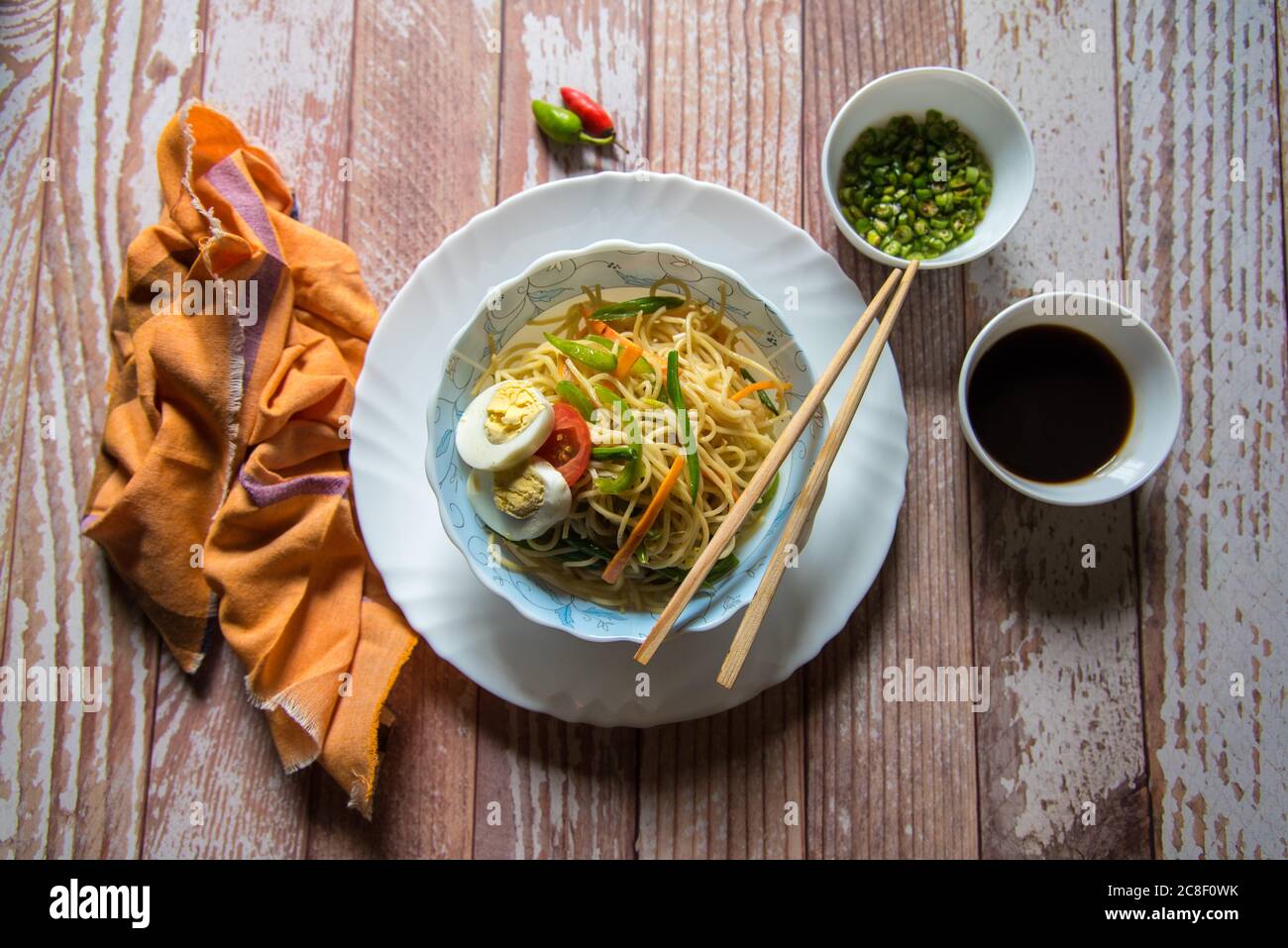 Noodles and condiments on a background Stock Photo - Alamy