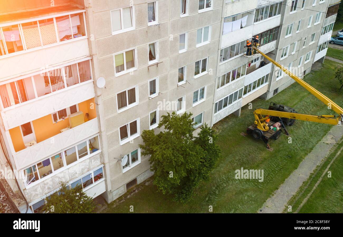 repair of the facade of a multi storey building using a tower crane ...