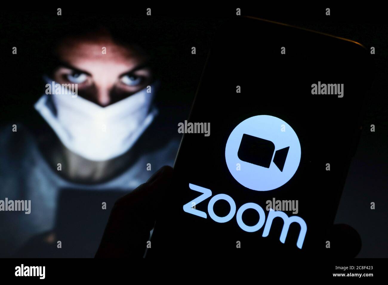 In this photo illustration a Zoom online communicator app logo seen ...