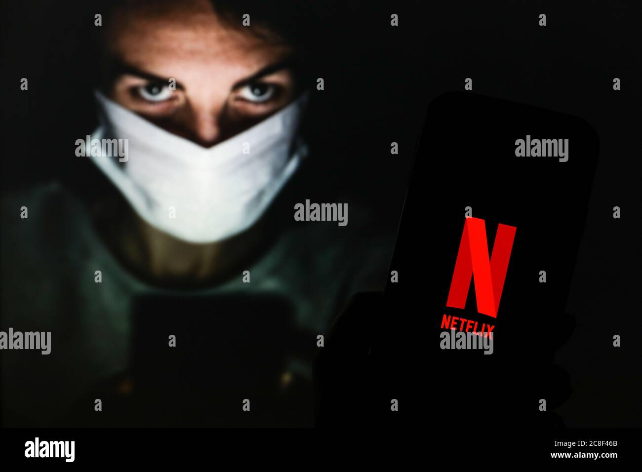 In this photo illustration a Netflix logo seen displayed on a ...