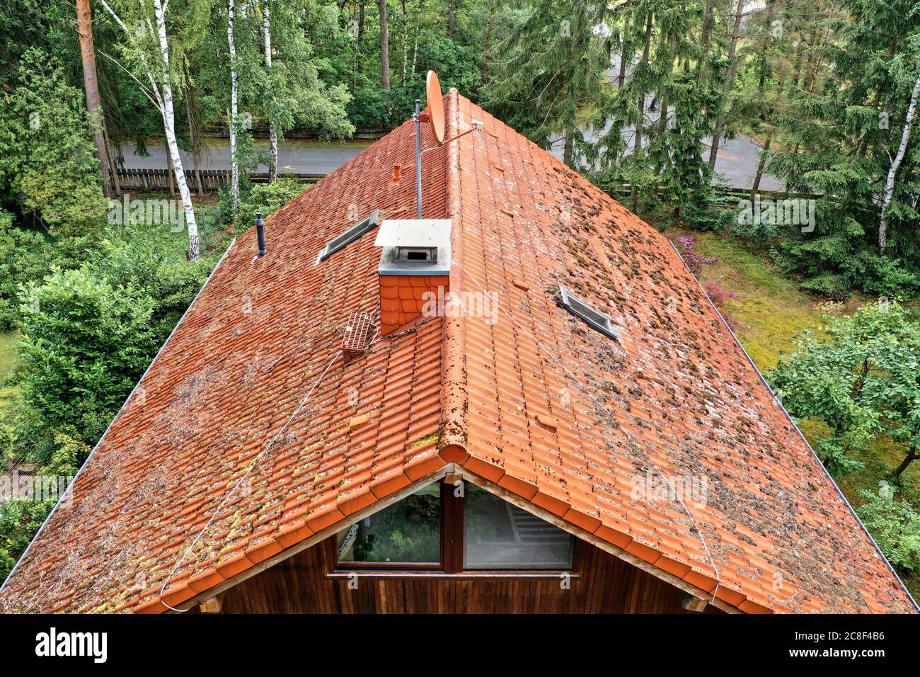 Checking the roof of a house with a drone, aerial photograph from the ...