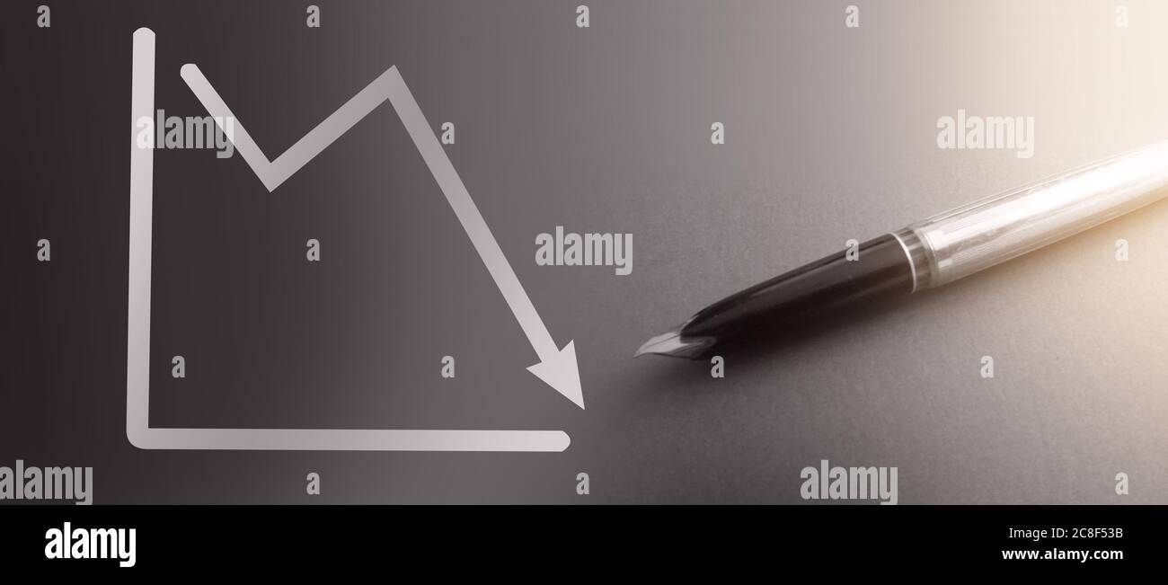 Financial graphs going down and pen . Business stock market concept ...
