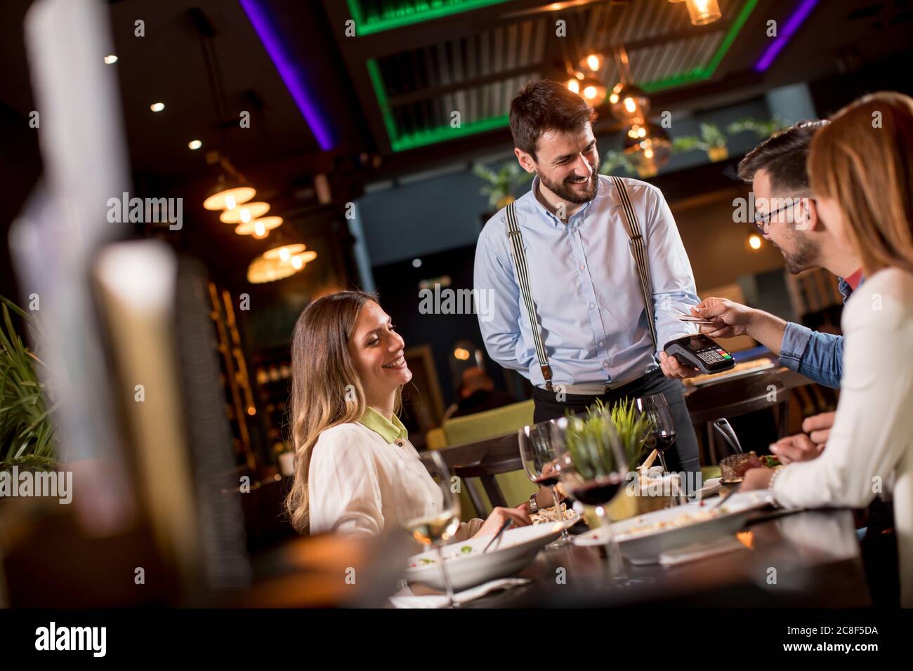 Woman group people paying bill hi-res stock photography and images - Alamy