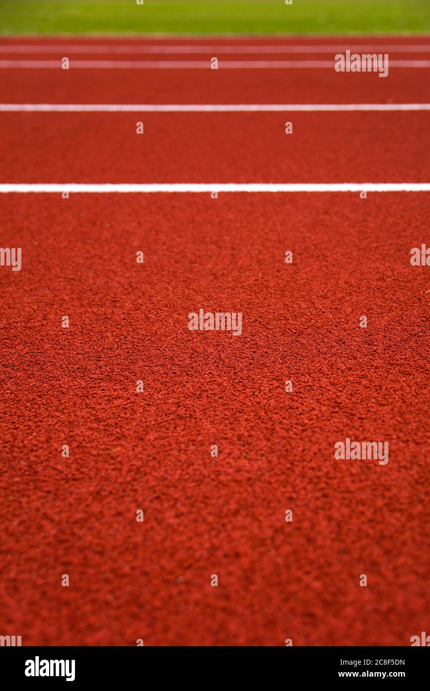 Closeup of the red stadium running track Stock Photo - Alamy